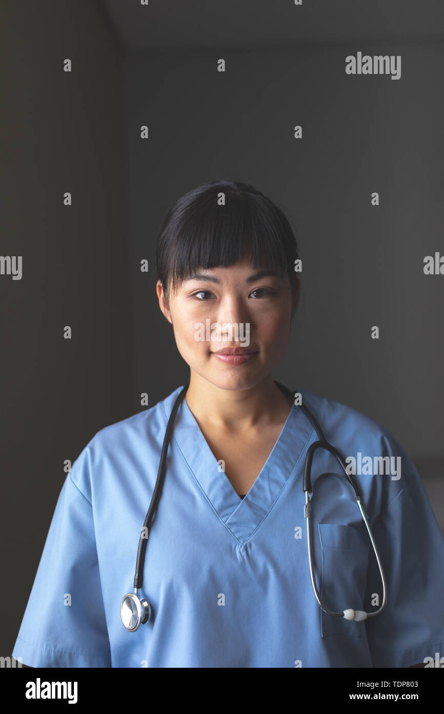 Happy female doctor standing in hospital Stock Photo - Alamy