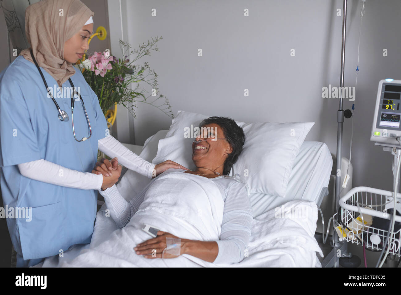 Doctor consoling female patient hi-res stock photography and images - Alamy