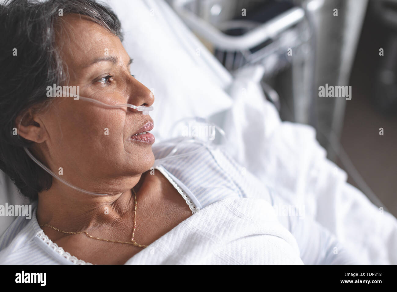 Female patient relaxing in bed in the ward at hospital Stock Photo - Alamy
