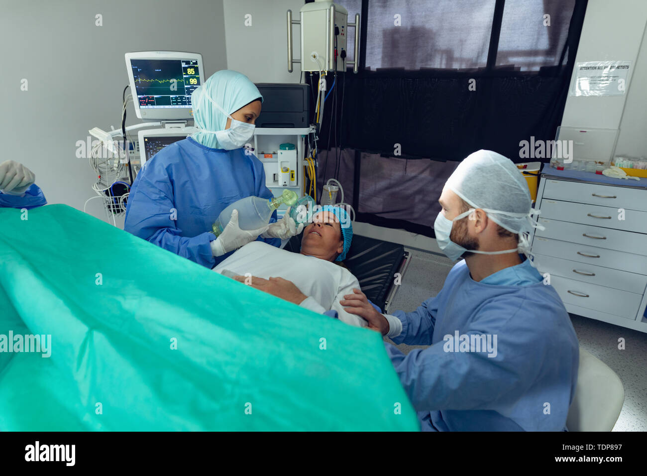 Man comforting pregnant woman during labor in operation theater Stock ...