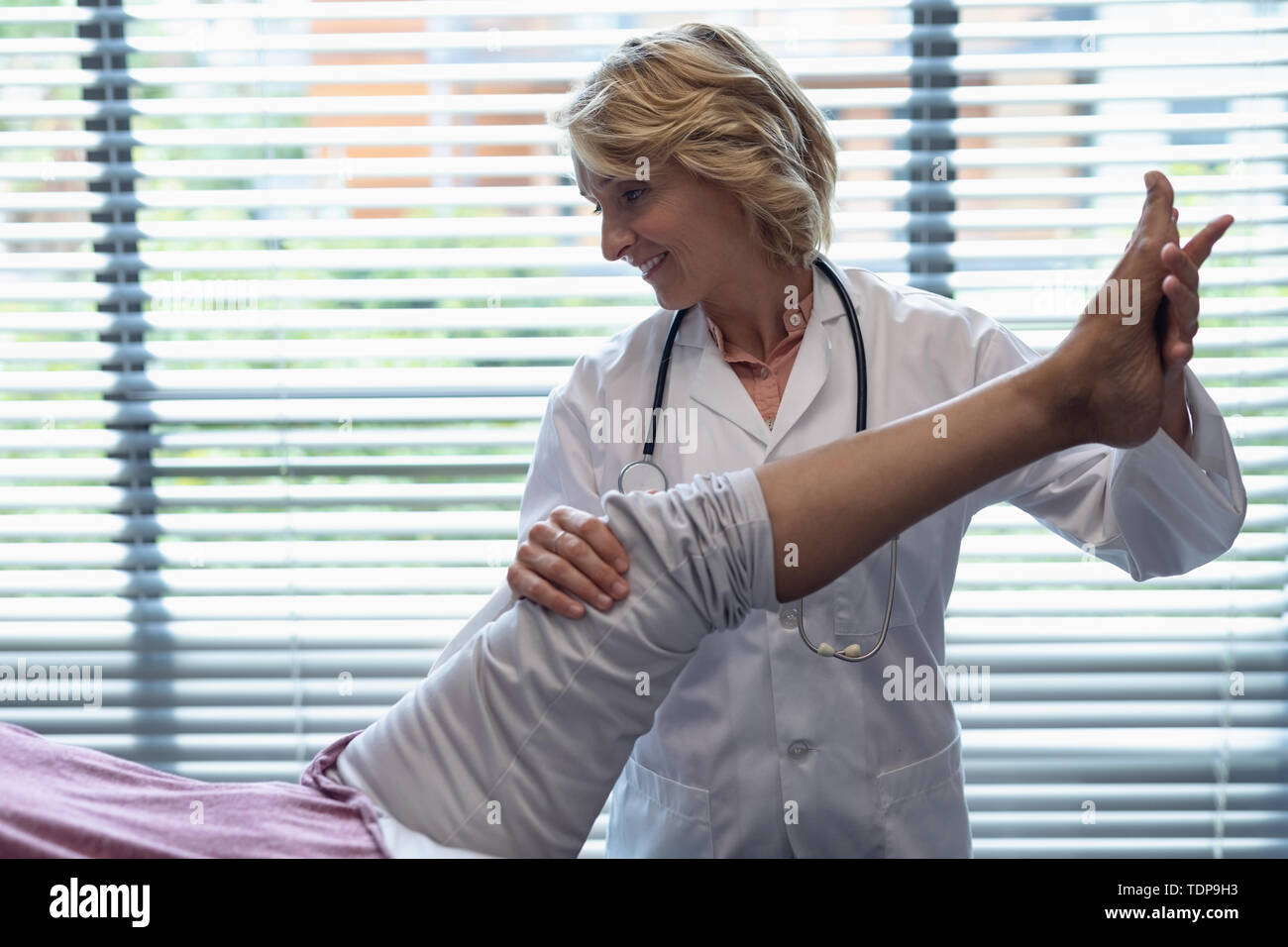 Doctor examining leg patient hospital hi-res stock photography and ...
