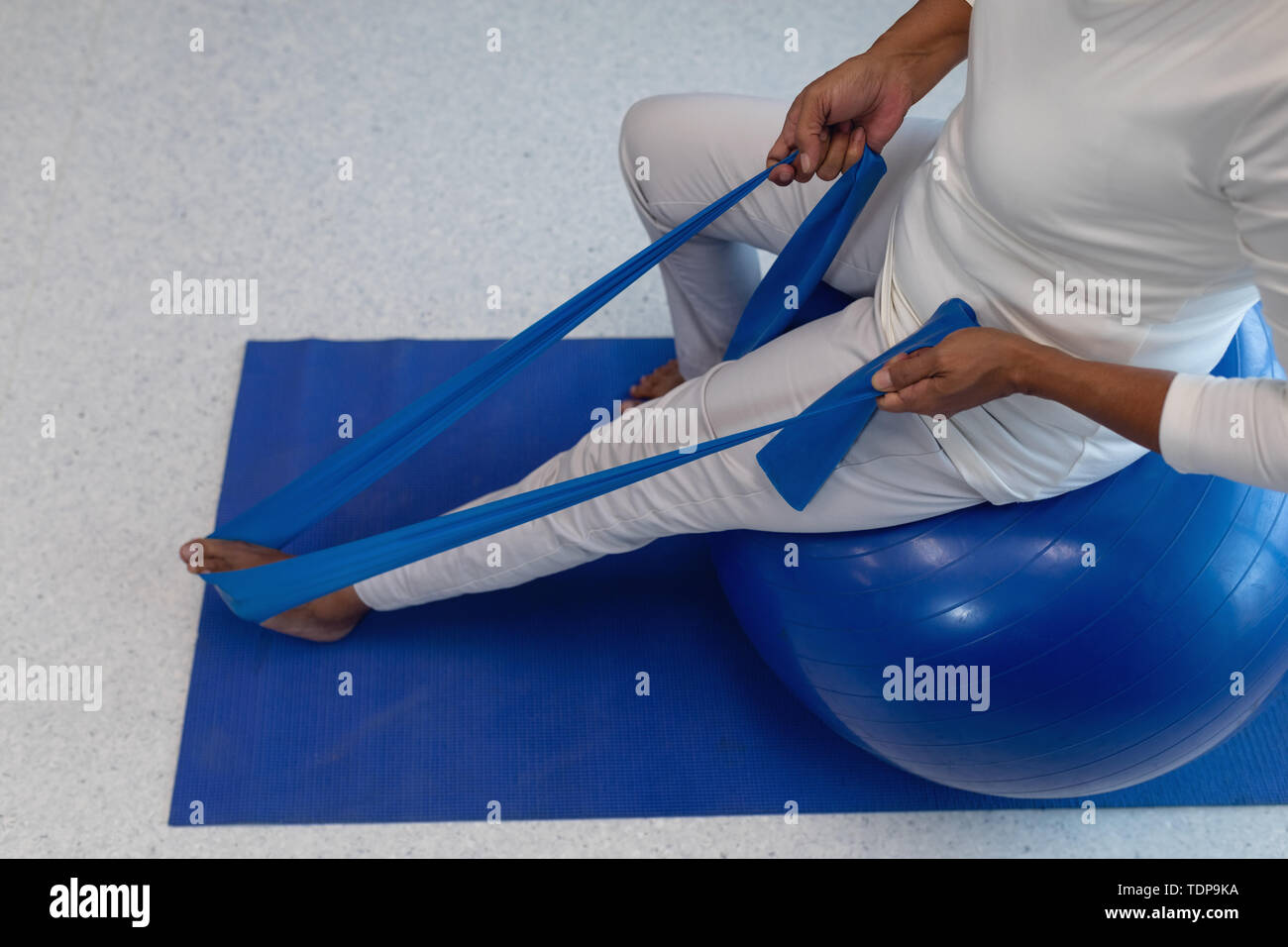 Female patient exercising with resistance band in the hospital Stock ...