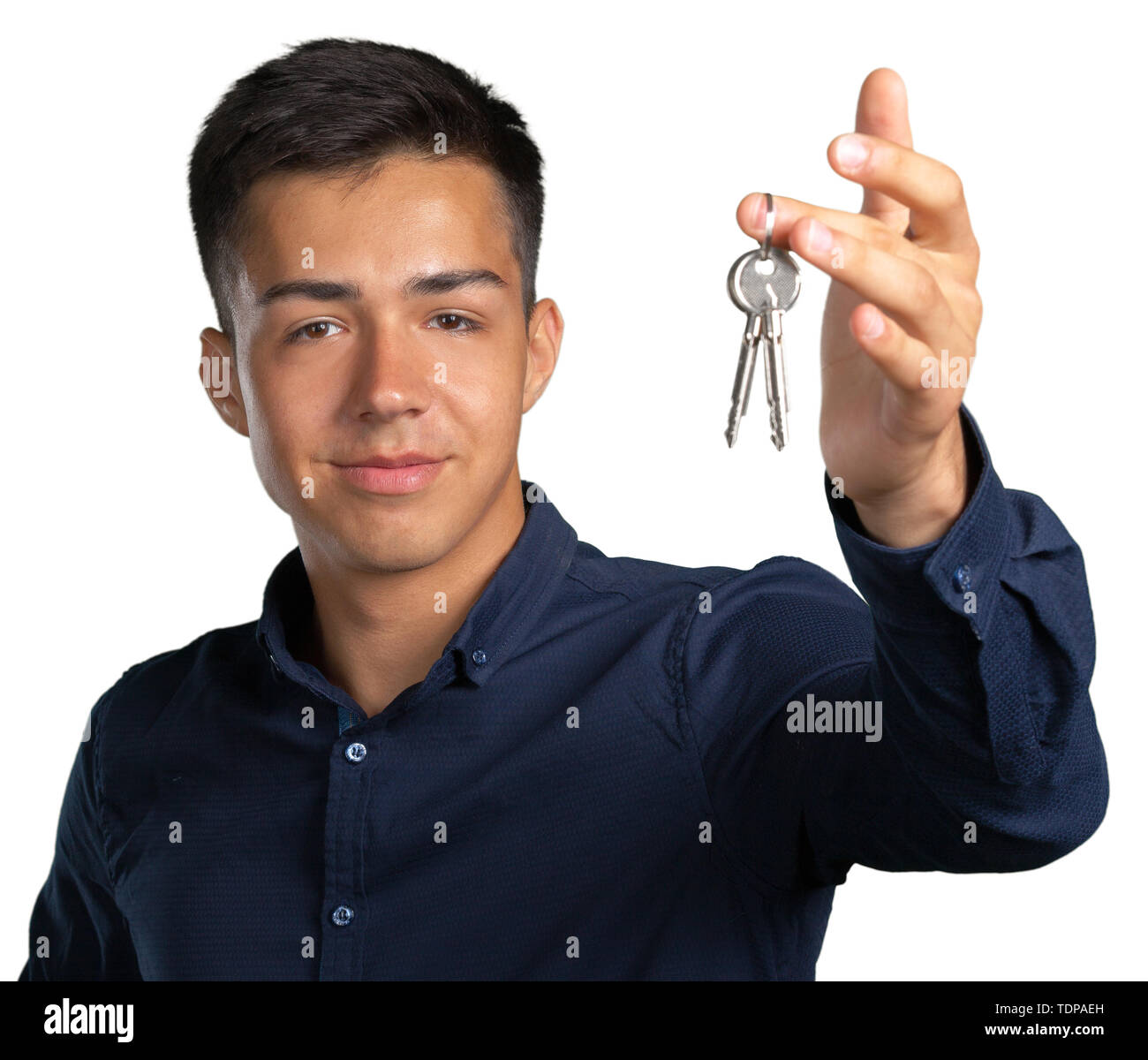 Young man holding set of house keys Stock Photo - Alamy