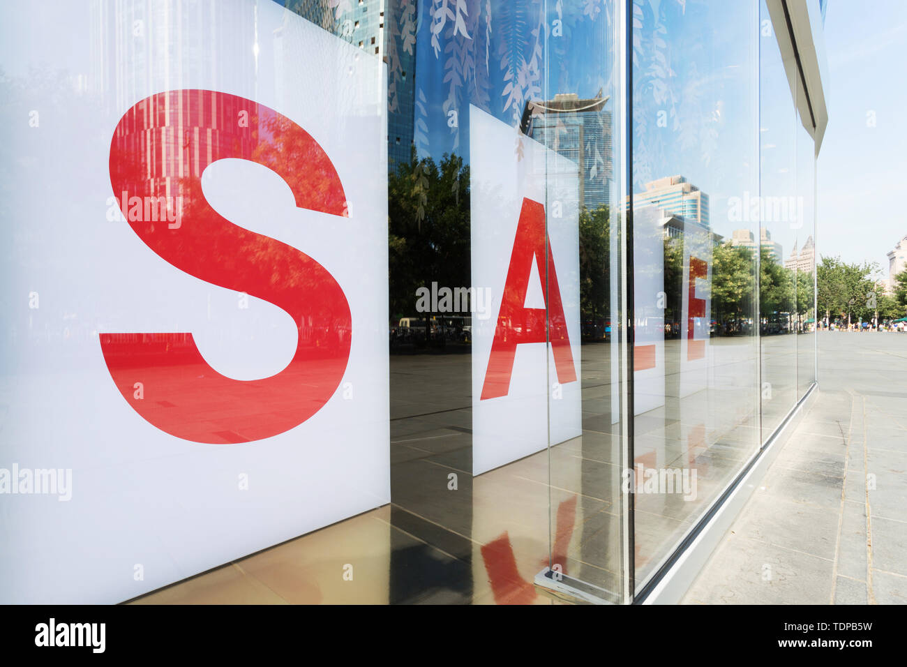 Sale poster in shop window Stock Photo - Alamy