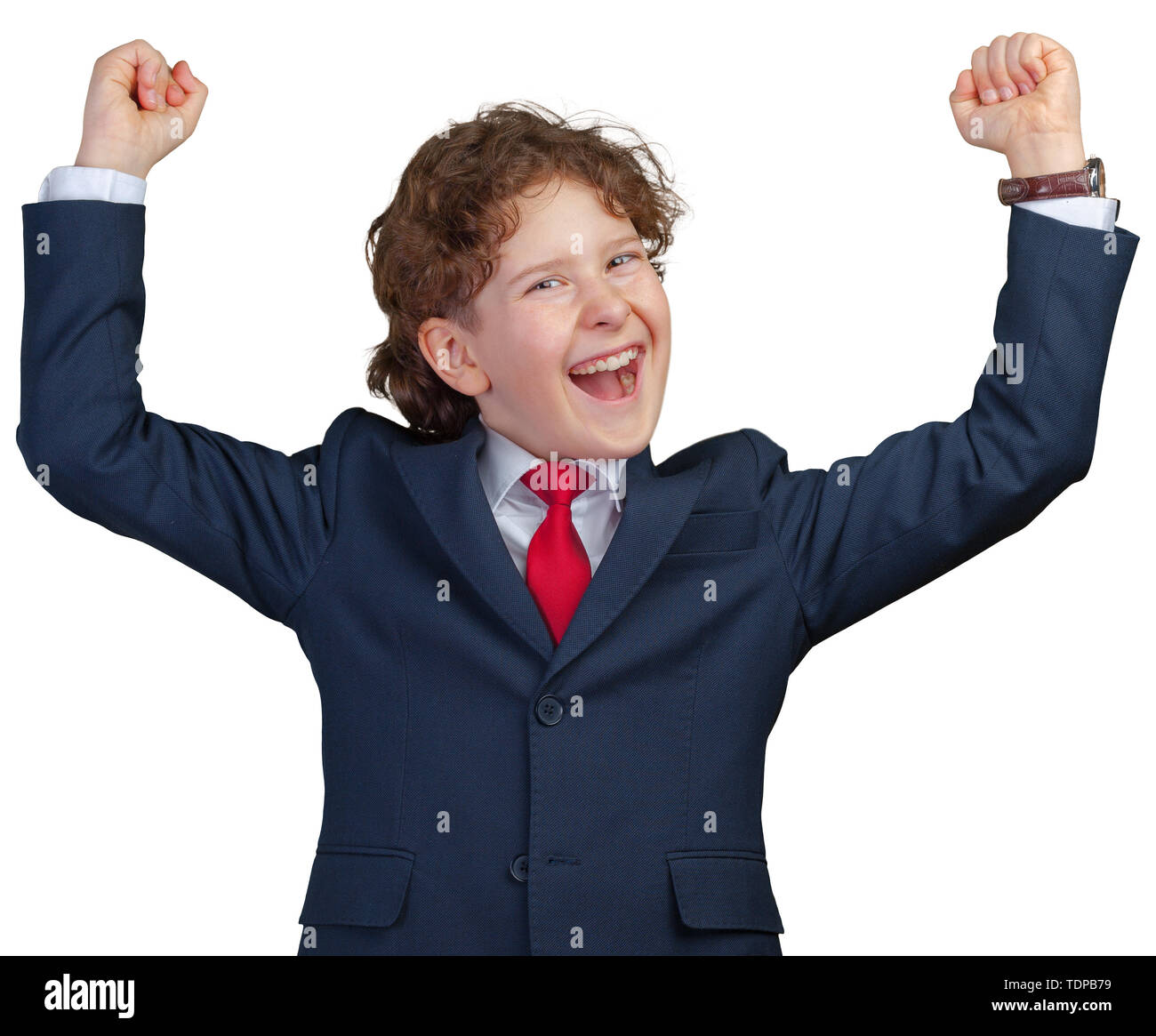 Self confident boy with raised fists celebrating a recent success Stock ...