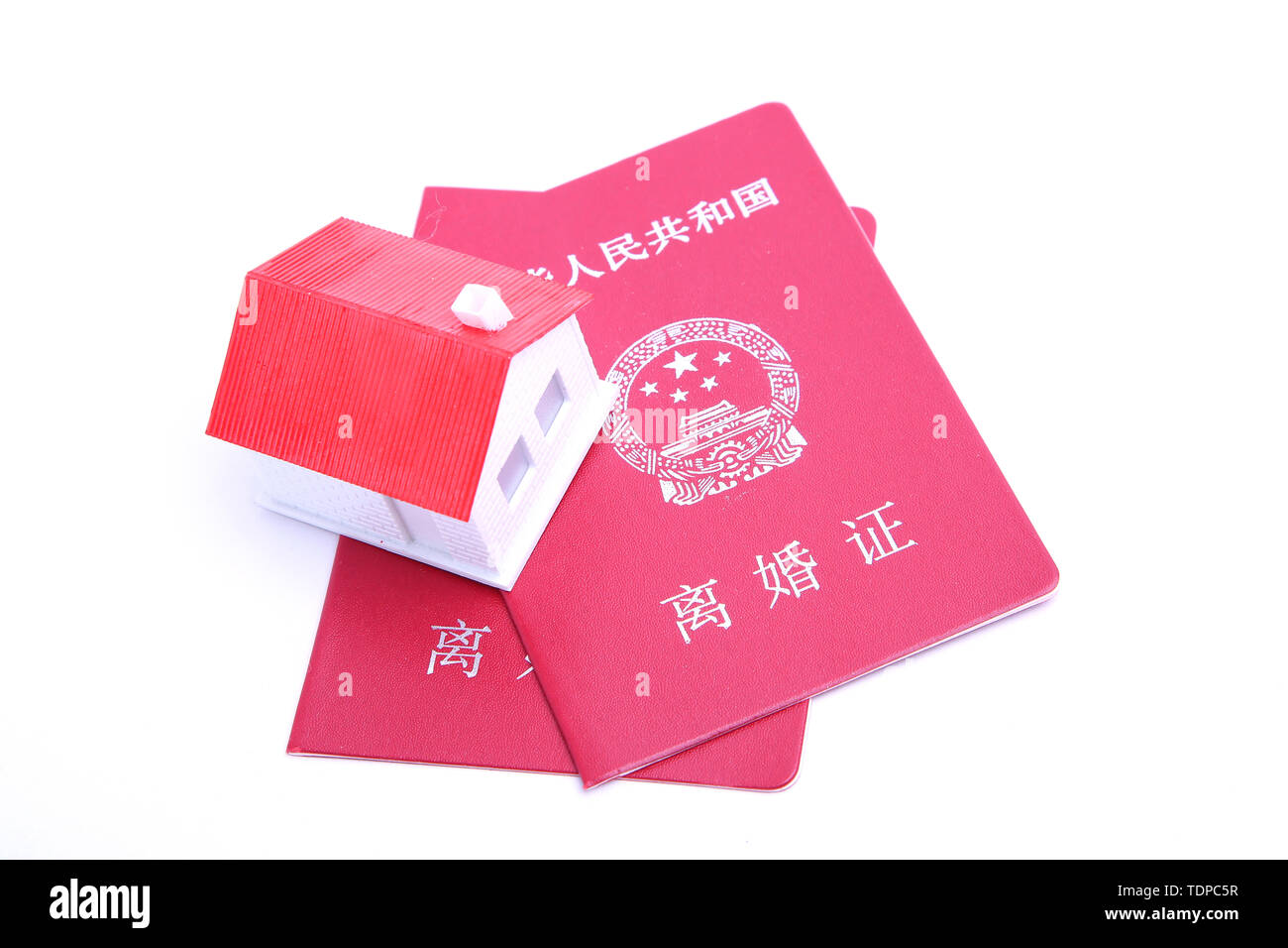 Divorce certificates and house models Stock Photo - Alamy