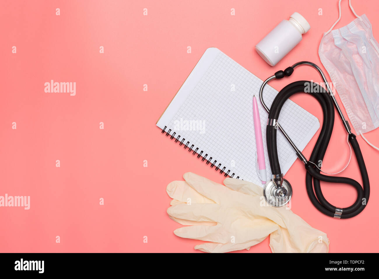 Medical equipment on a pink pastel background Stock Photo - Alamy
