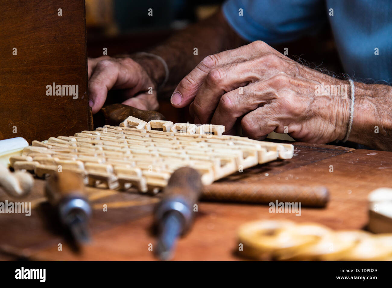 Carpenter with chisel in the hands on the workbench Stock Photo - Alamy