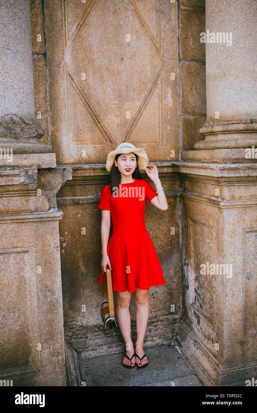 Red dress tour the big three buses Stock Photo - Alamy