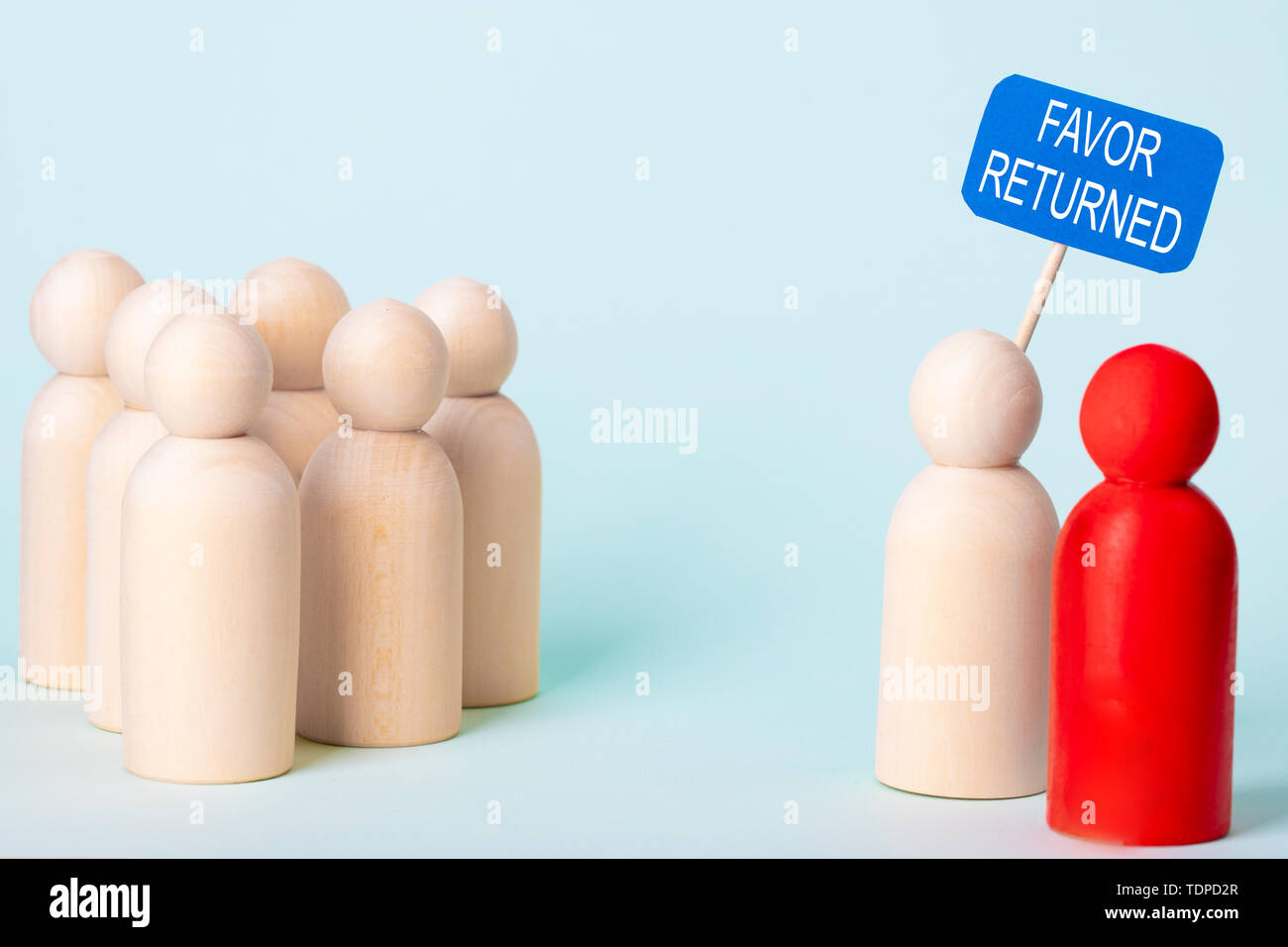 Wooden figures with the text Favor returned Stock Photo - Alamy