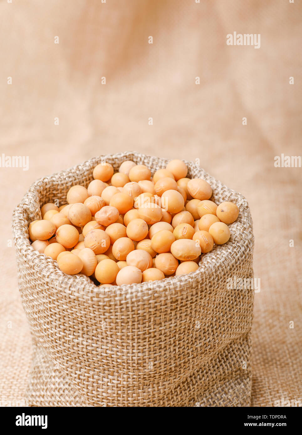 Gold-yellow beans in the bag Stock Photo - Alamy