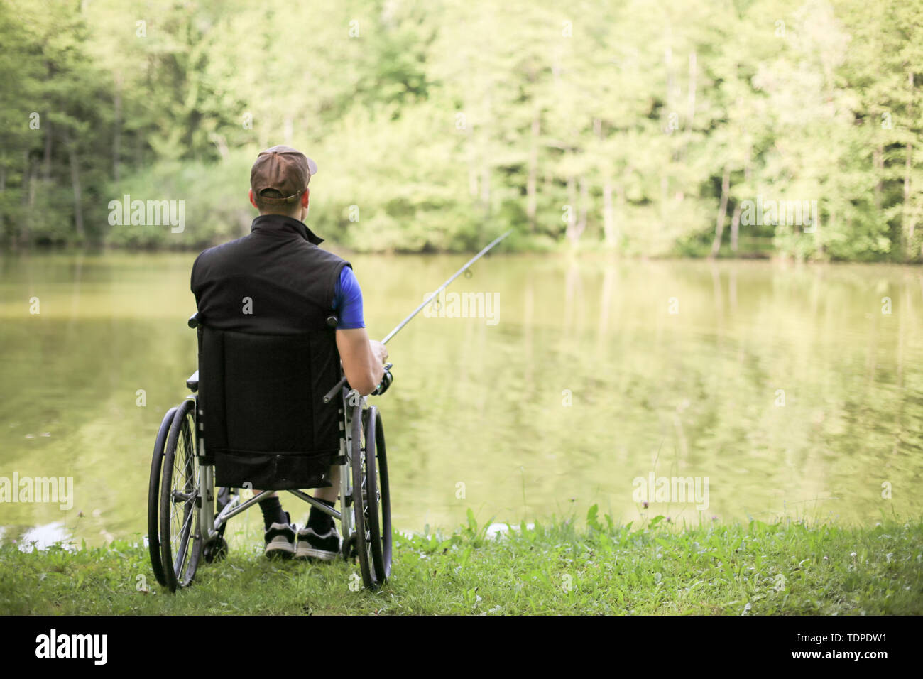 Disabled man fishing hi-res stock photography and images - Alamy