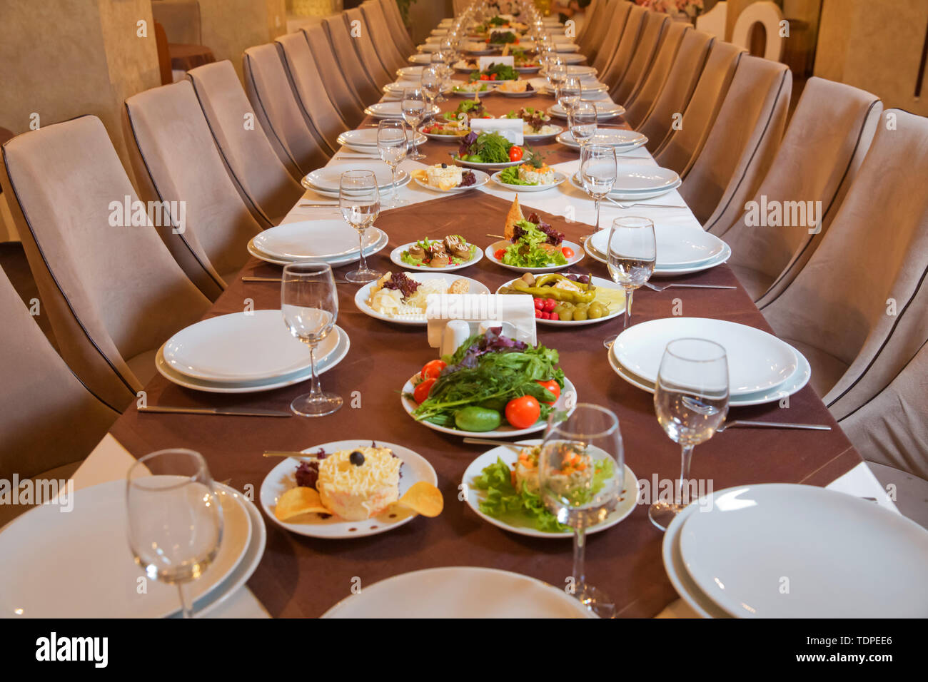 Tablet set service with silverware and glass at restaurant before party ...