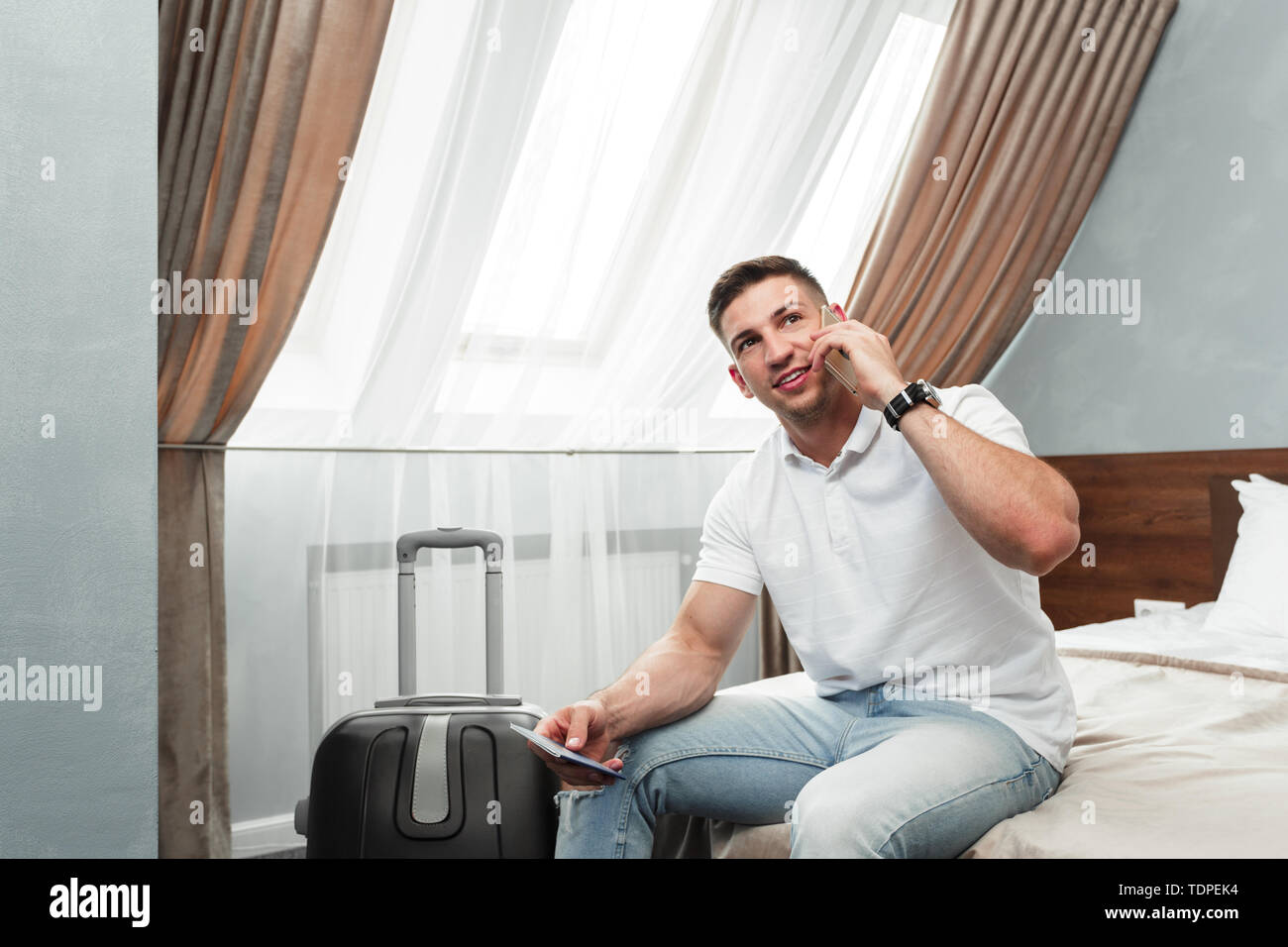 Man using telephone in hotel room hi-res stock photography and images ...