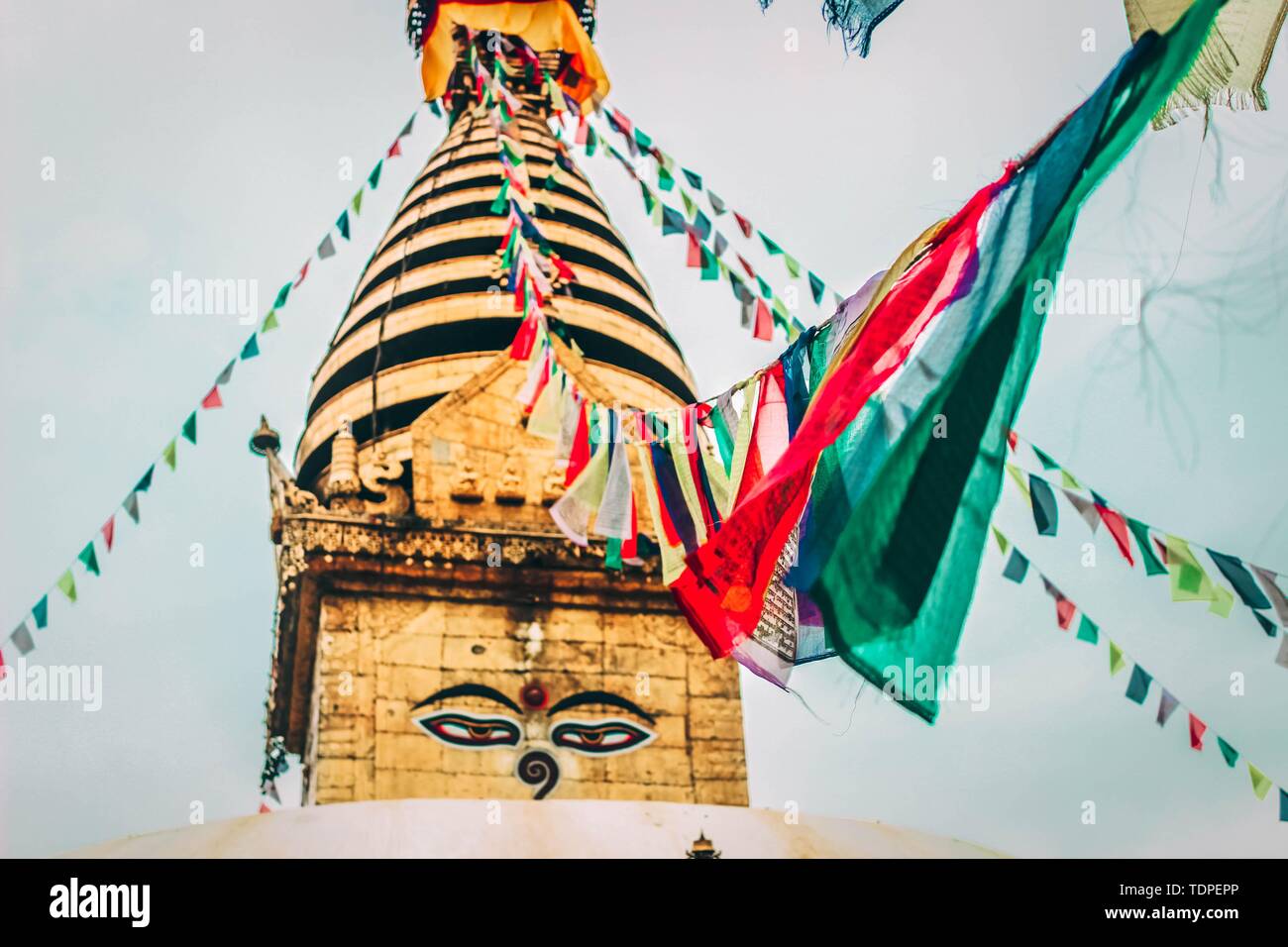 Buddhist prayer flags hung on a rope tied to a temple dome Stock Photo ...