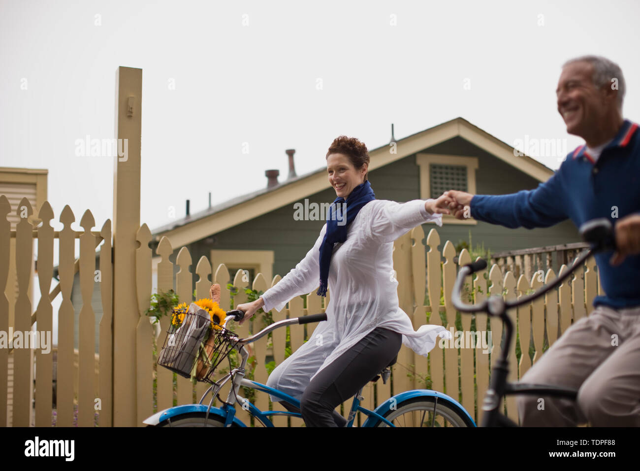 Couple riding bikes together Stock Photo - Alamy
