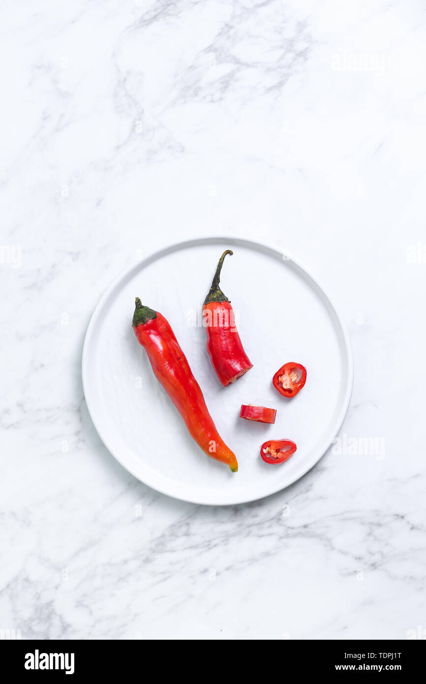 The chili peppers on the plate Stock Photo - Alamy
