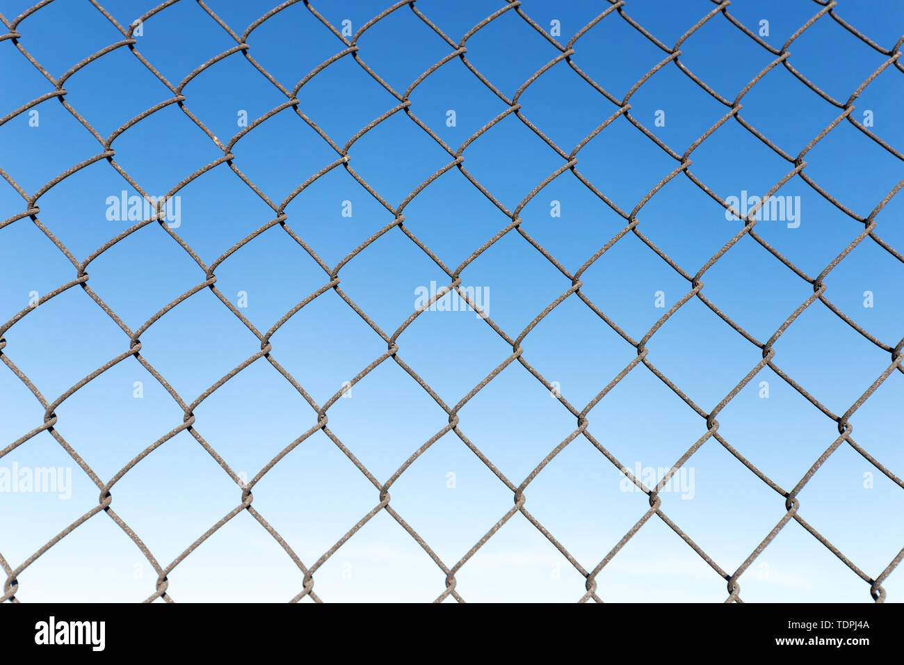 Steel net with blue sky background Stock Photo - Alamy