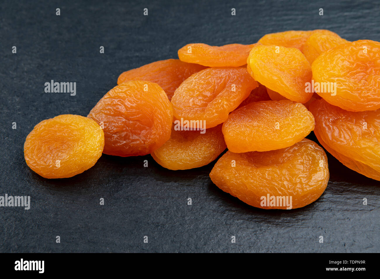 Naturally dried apricots. Food background or texture Stock Photo - Alamy