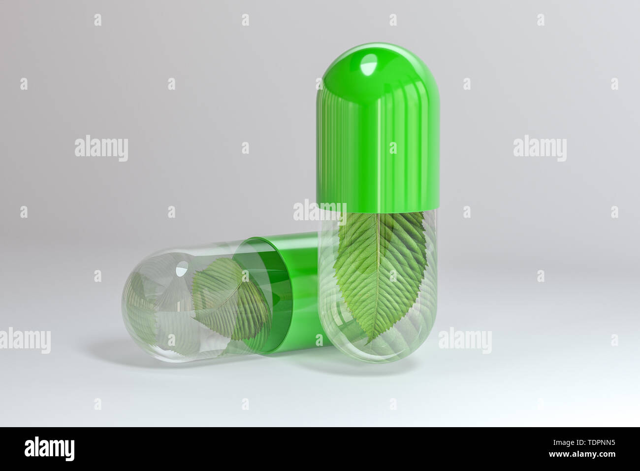 Three dimensional rendering, green capsule with pure white background ...
