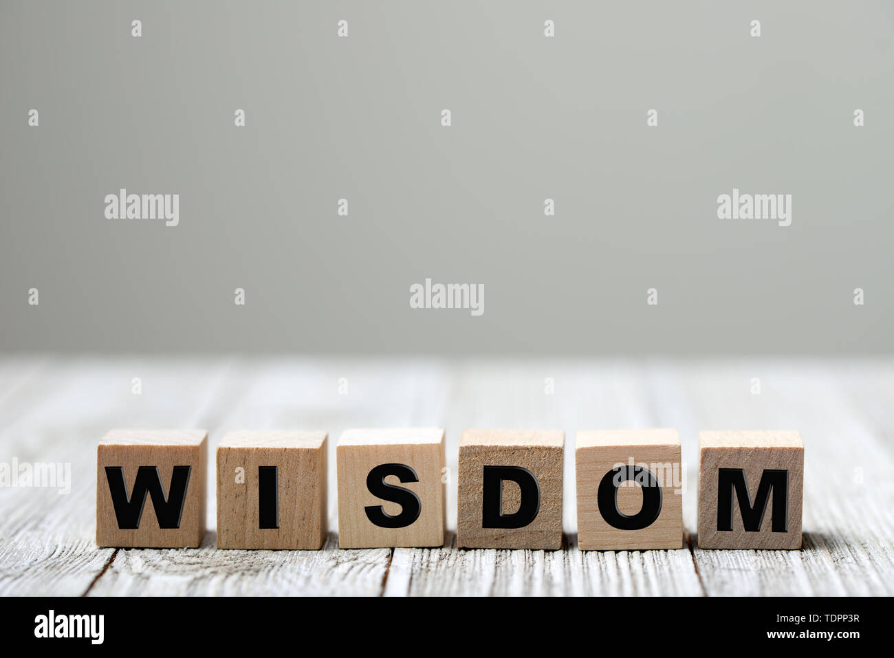 Wisdom word written on wood block Stock Photo - Alamy