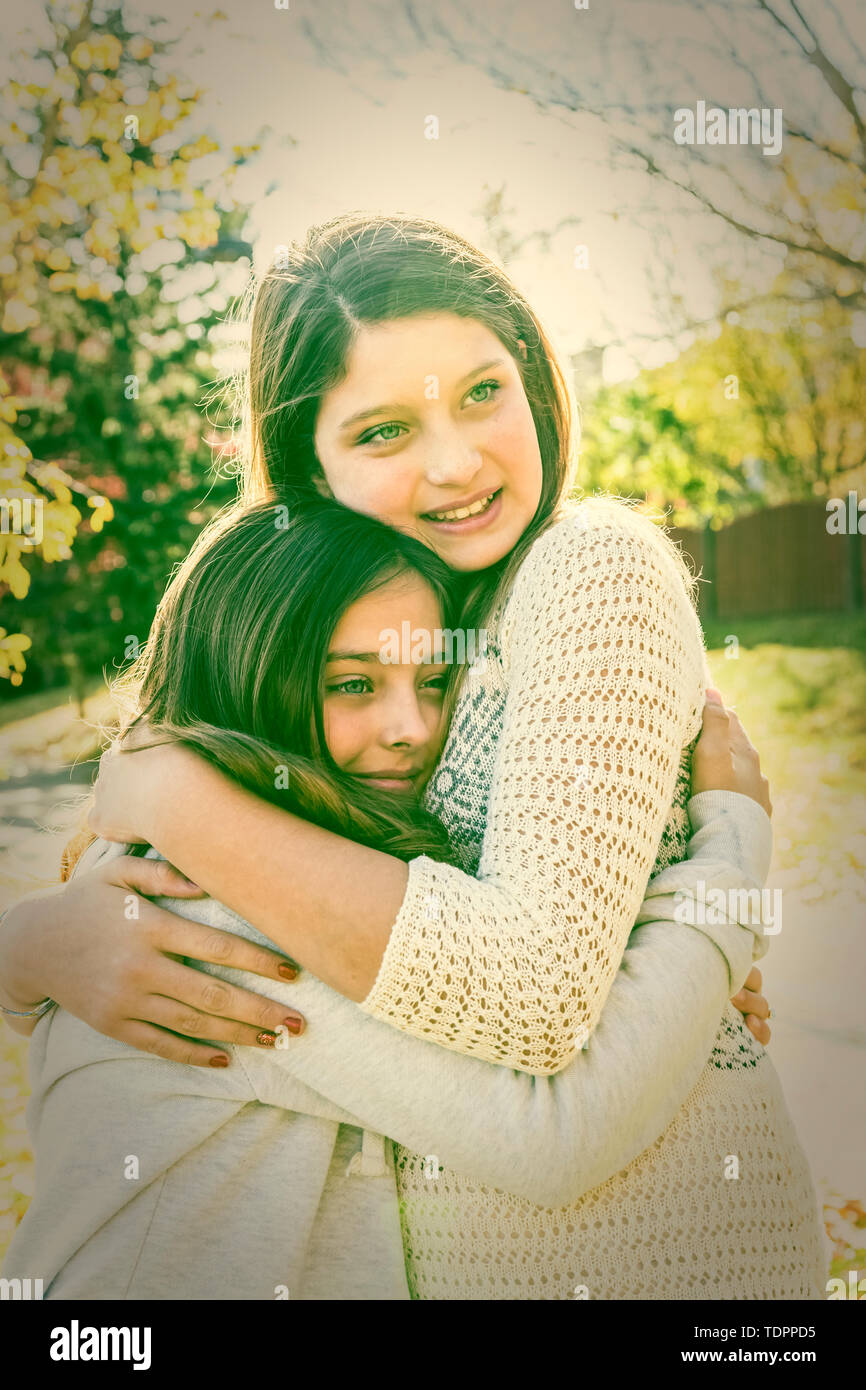 Two Sisters Hugging