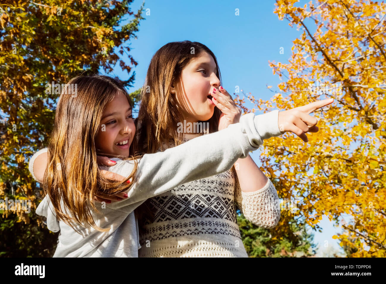Two sisters see an embarrassing situation while in a city park on a ...