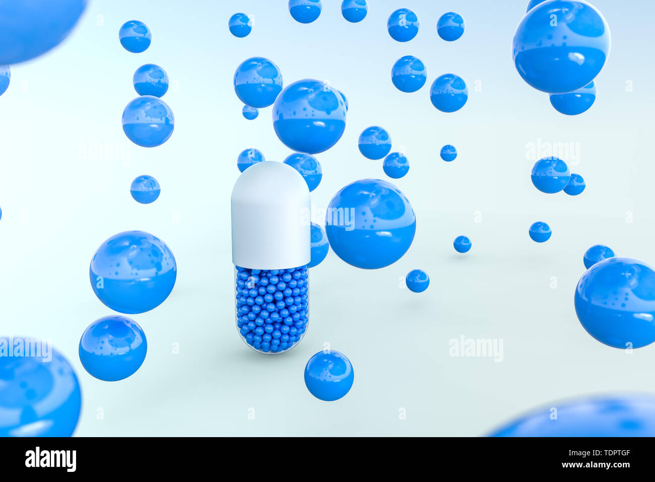 Blue granular capsule, 3-D rendering Stock Photo - Alamy