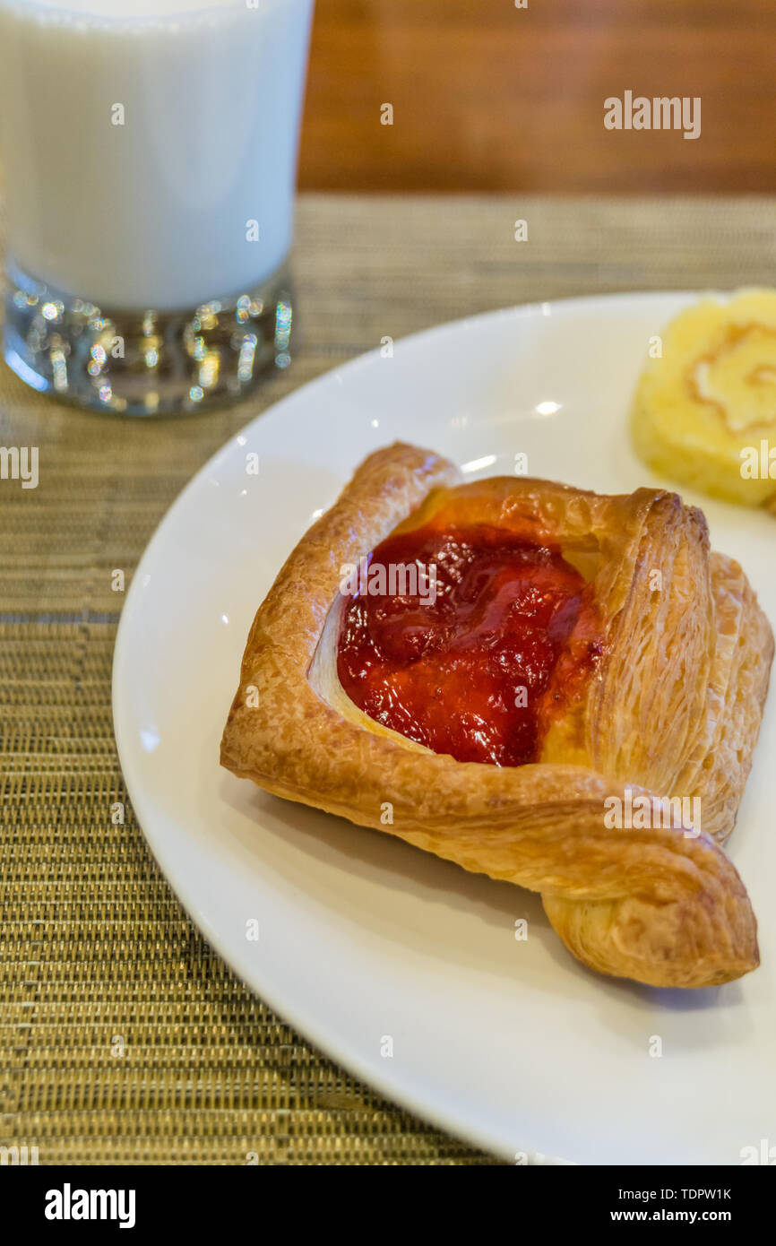 Strawberry jam bread and cake roll close-up Stock Photo - Alamy