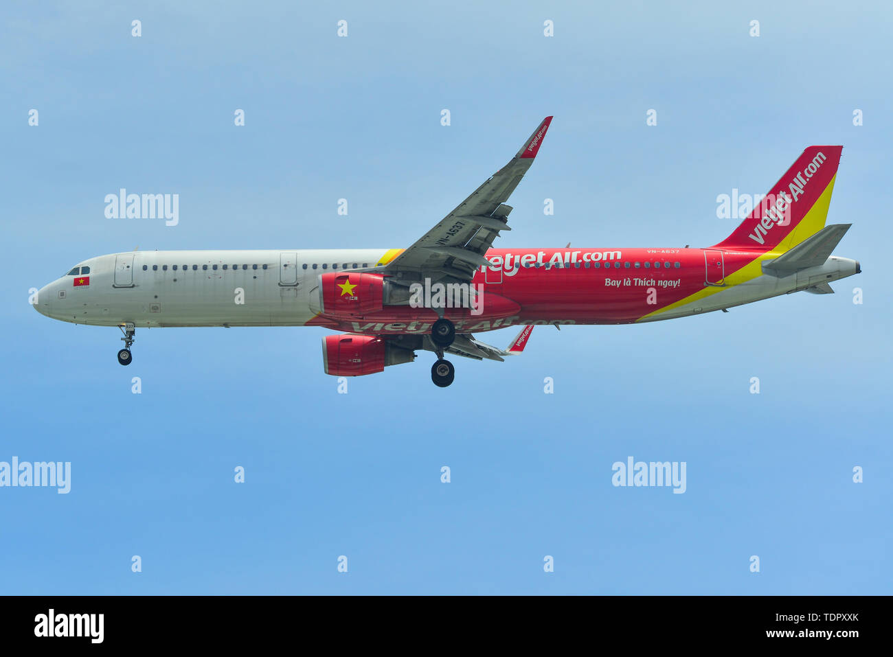 Saigon, Vietnam - Jun 16, 2019. VietJet Air VN-A637 (Airbus A321) landing at Tan Son Nhat ...