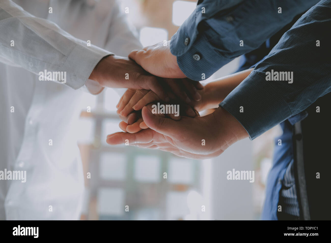 businessman joining united hand, business team touching hands together ...