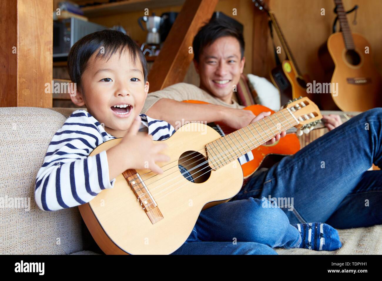 Japanese kid with father at home Stock Photo - Alamy