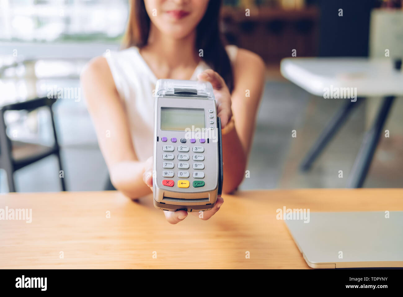 woman with credit card swiping machine. shopping lifestyle and payment ...