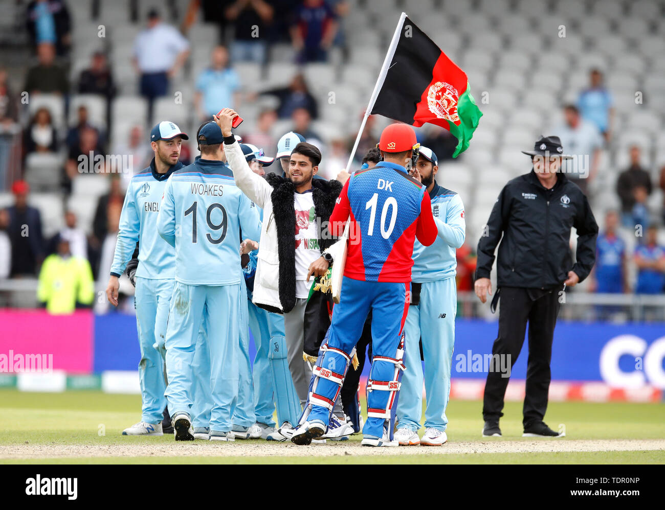 A pitch invader as both teams shake hands after the ICC cricket World ...