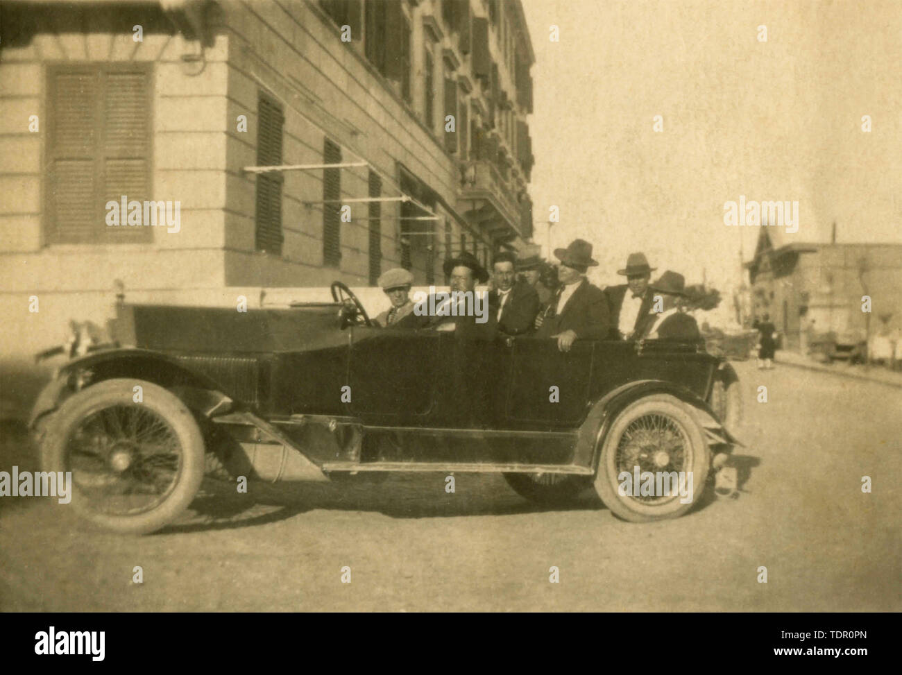 Large group of men in a car, Italy 1920s Stock Photo - Alamy