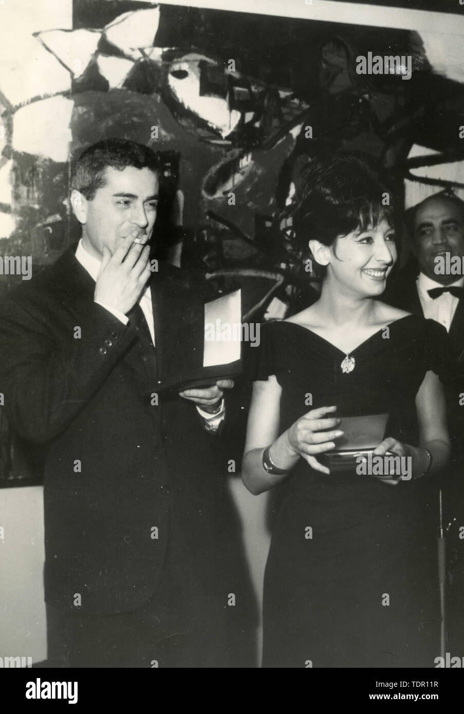 Italian actors Marisa del Frate and Raffaele Pisu receiving the golden ...