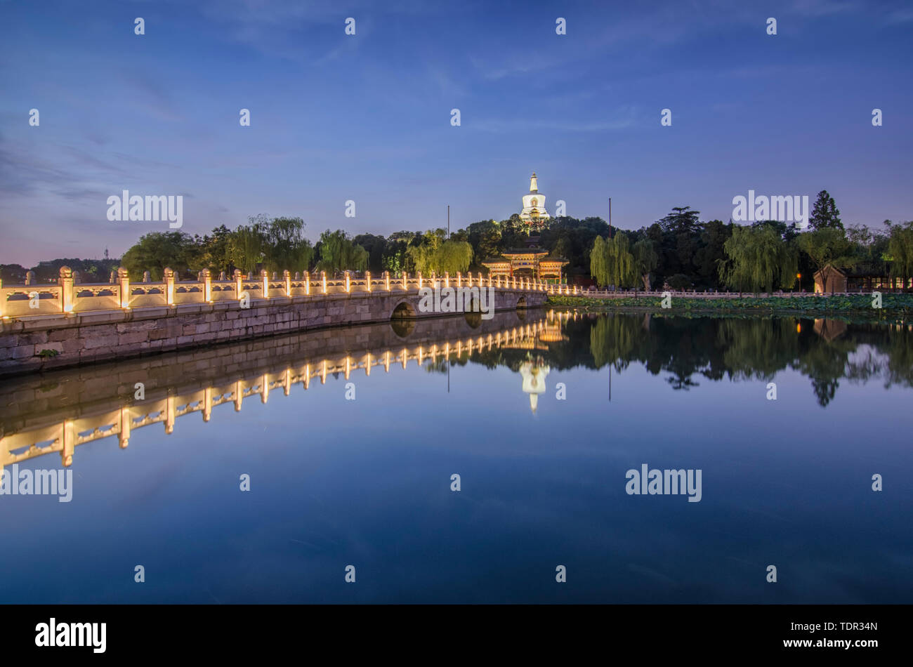 The sea reflected the beautiful white tower Stock Photo - Alamy