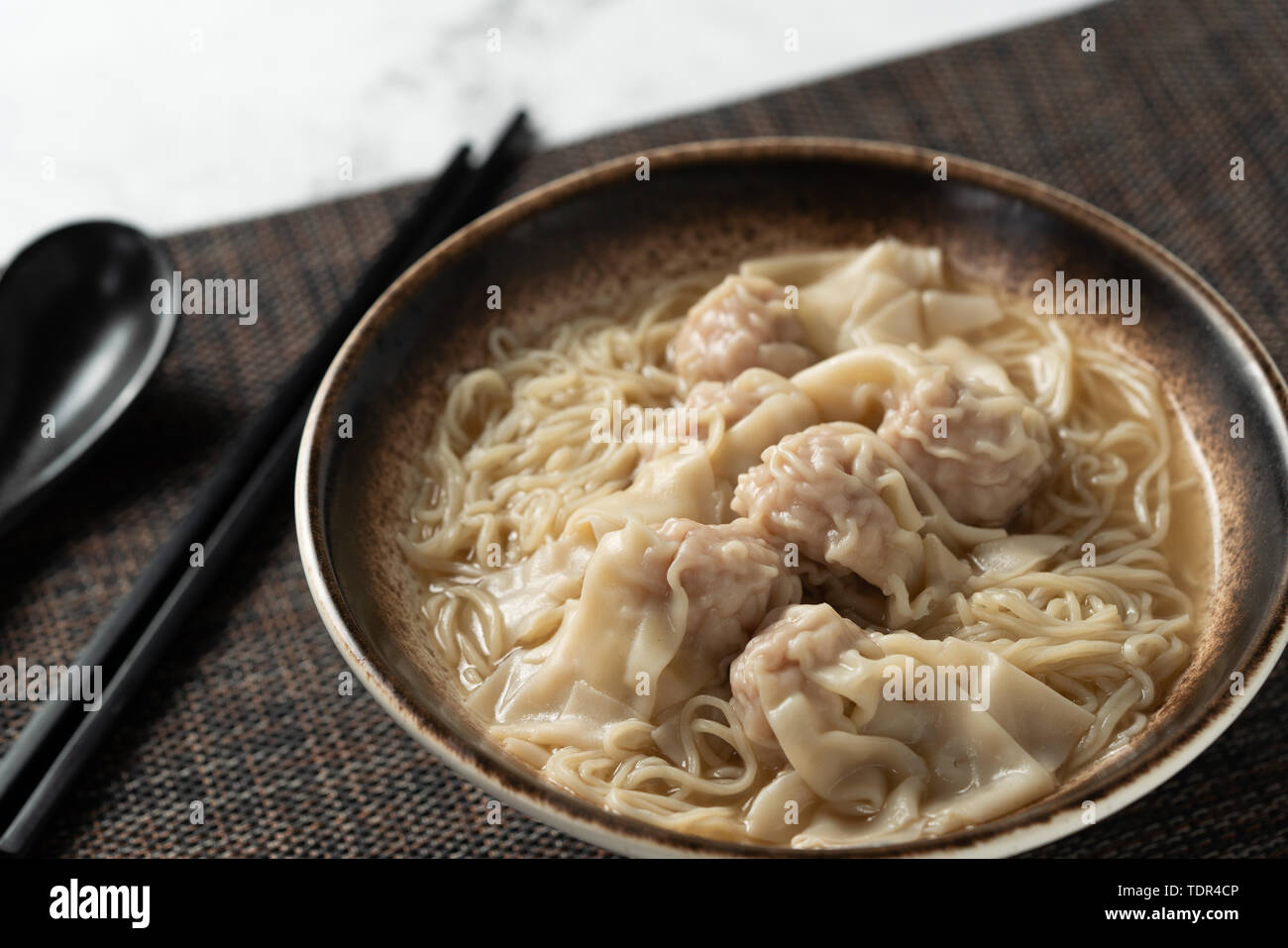 Cloud noodles on a marble table Stock Photo - Alamy