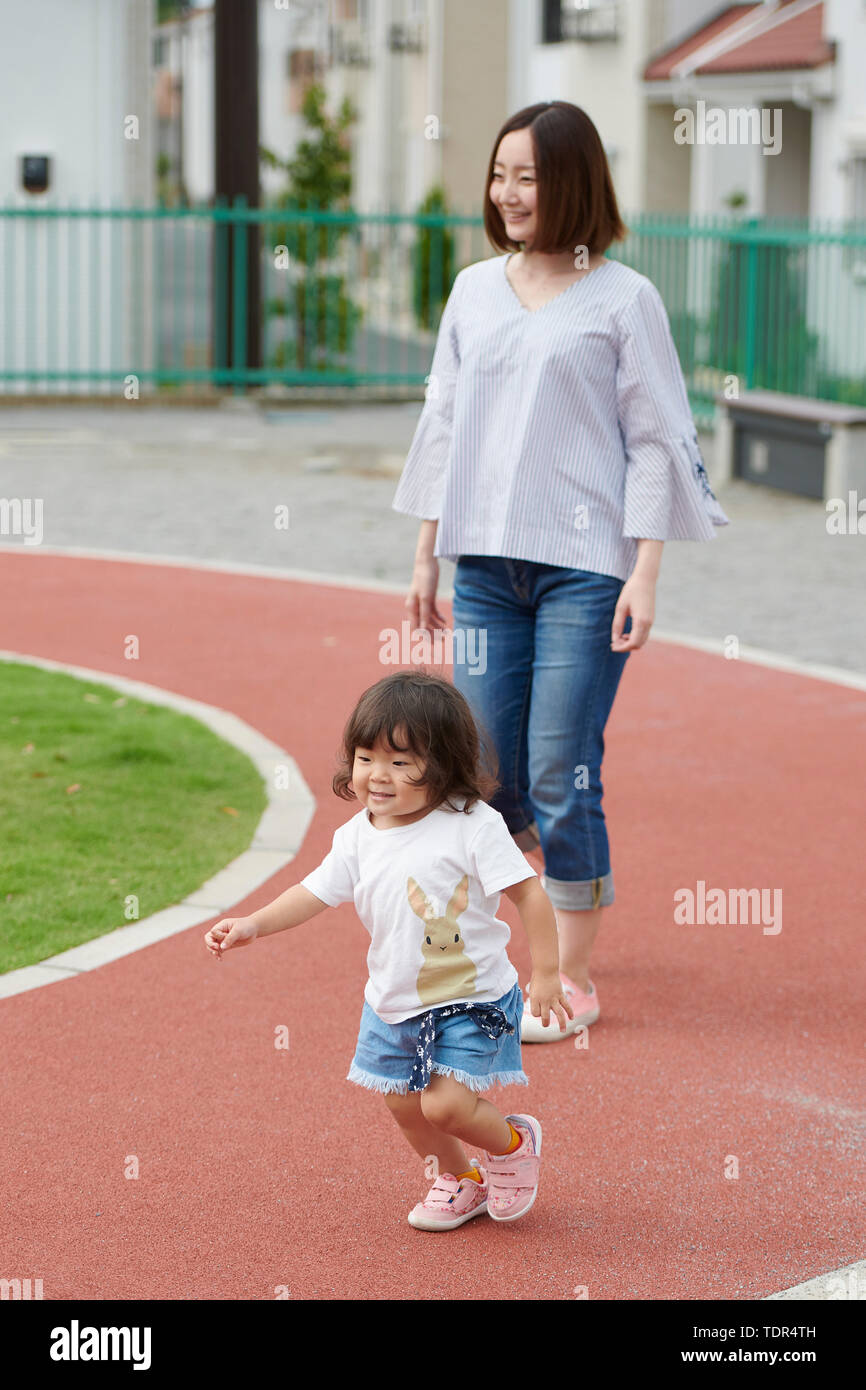 Mom with 2 children running hi-res stock photography and images - Alamy