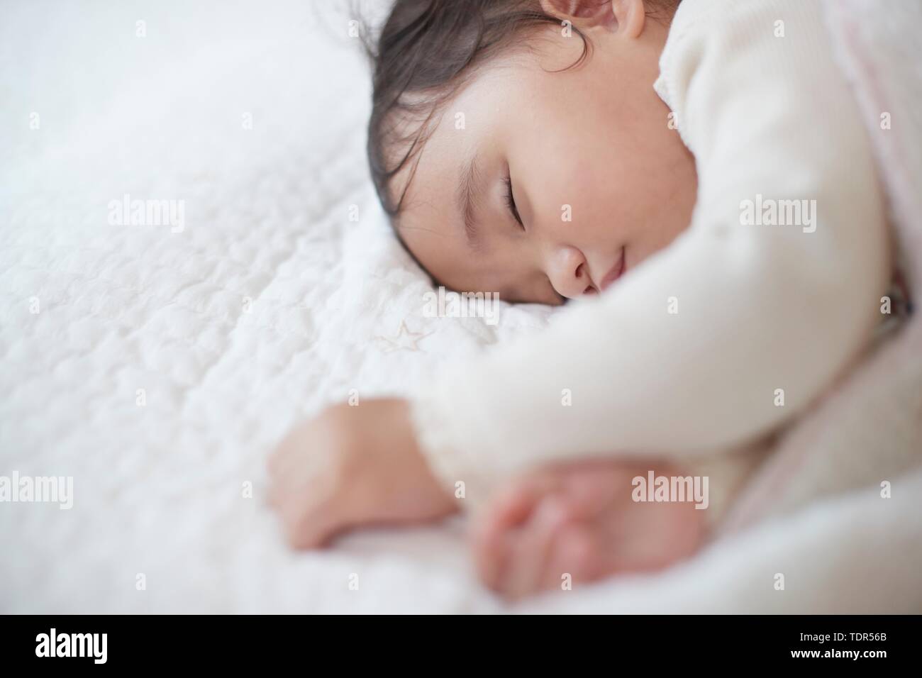 New born baby girl sleeping hi-res stock photography and images - Alamy