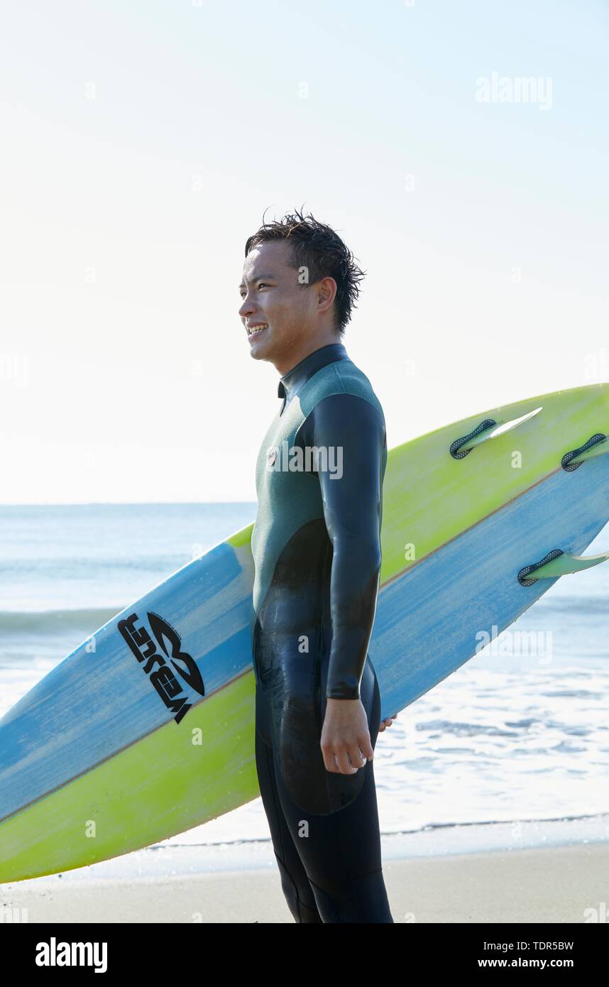 Japanese surfer at the beach Stock Photo - Alamy