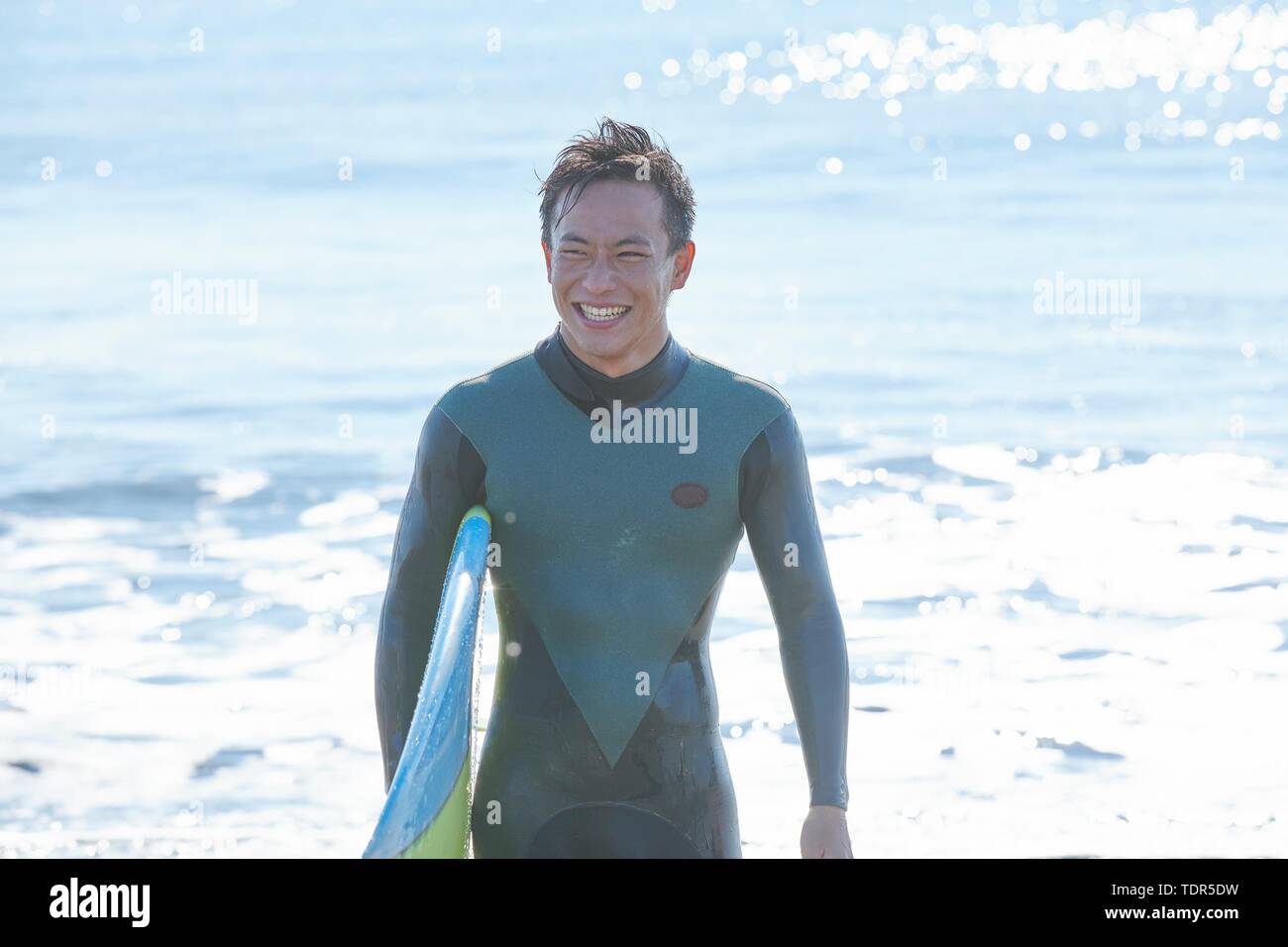Japanese surfer at the beach Stock Photo - Alamy