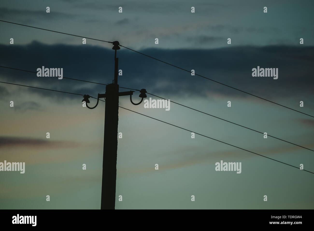 electric support against the sky and clouds Stock Photo - Alamy