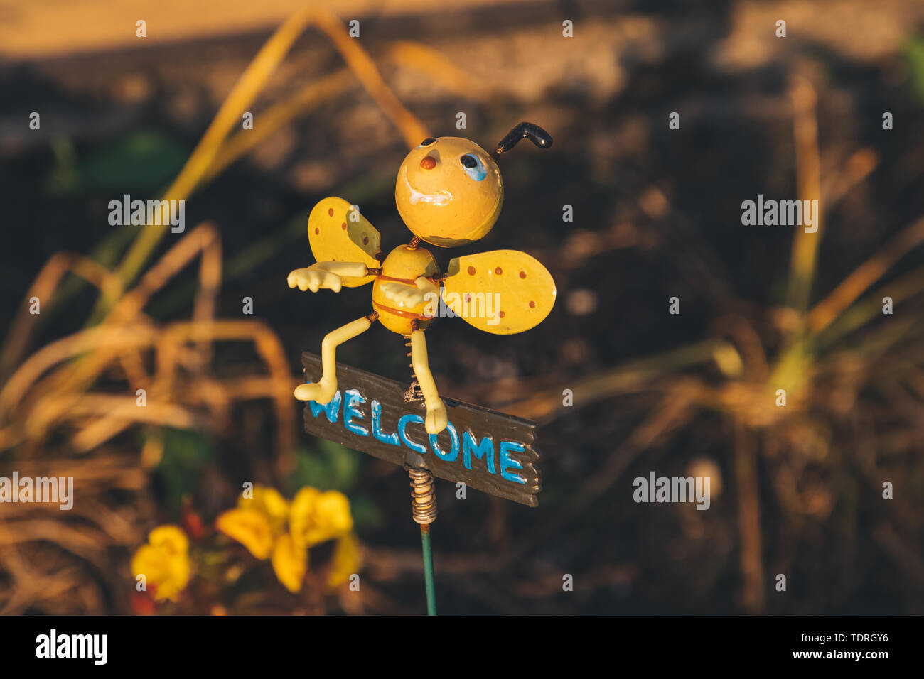 bright toy bee with the inscription welcome Stock Photo - Alamy