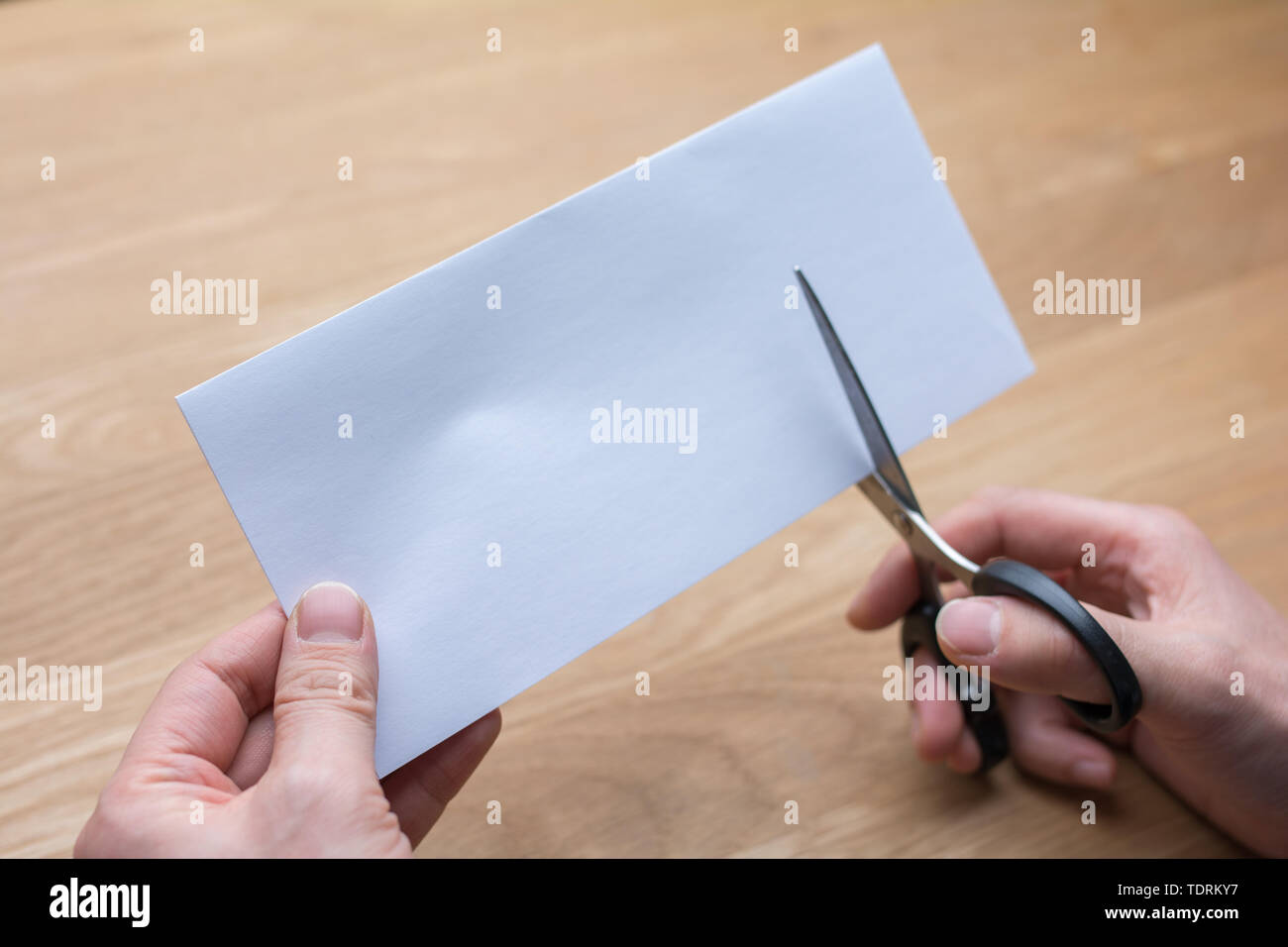 Topping cutting paper by scissors Stock Photo - Alamy