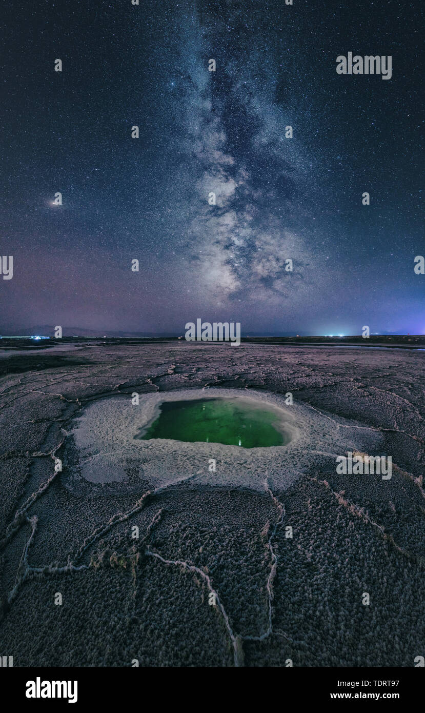 A salt eye on the emerald lake in Dachaidan, Qinghai. A low-angle wide ...