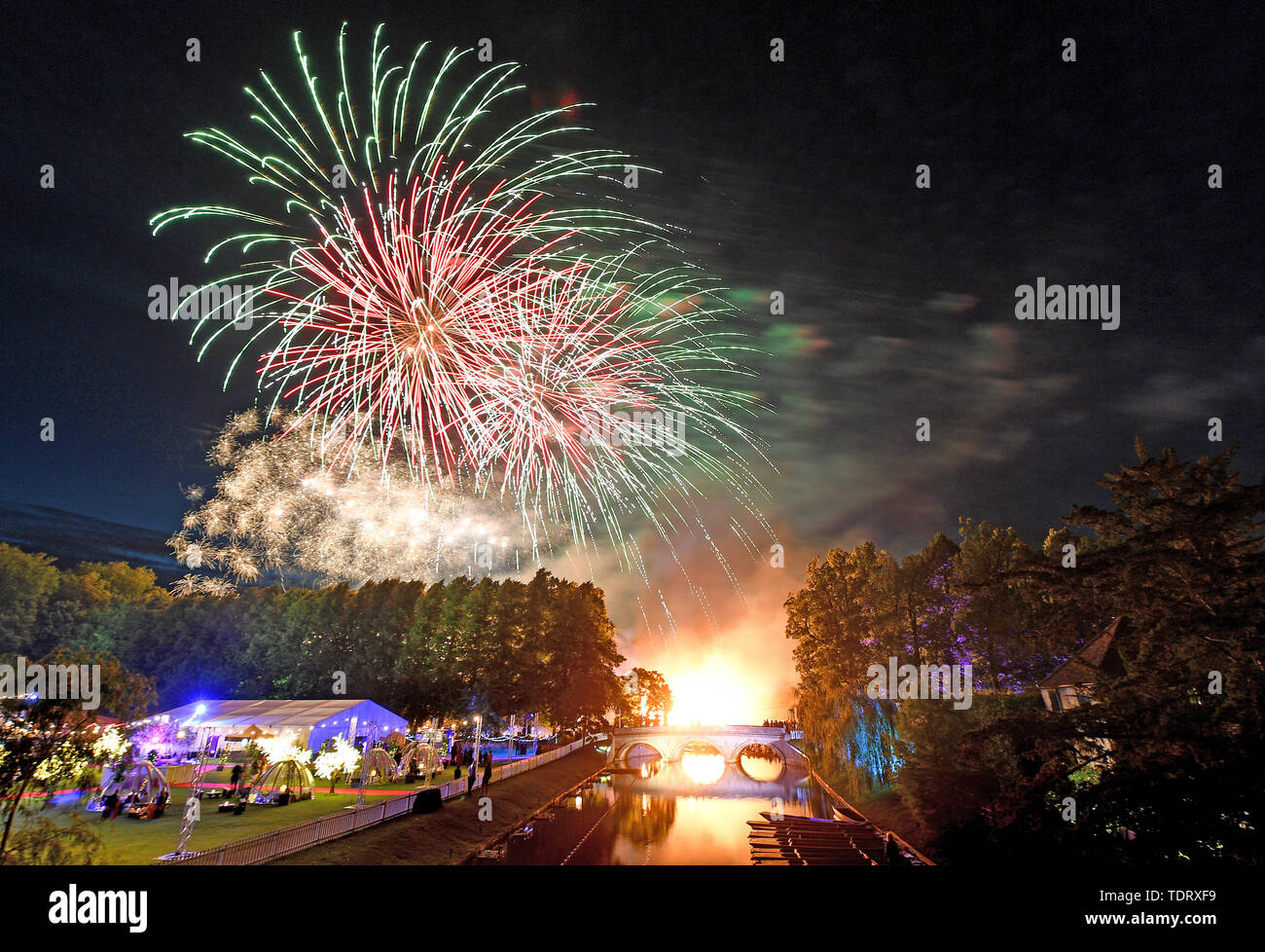 Students from Trinity College at Cambridge University enjoy a firework ...