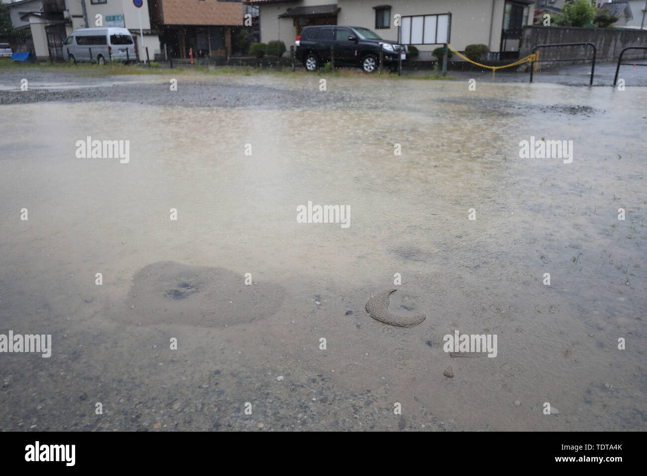 Tsuruoka, Japan. 19th June, 2019. An area hit by liquefaction is seen ...