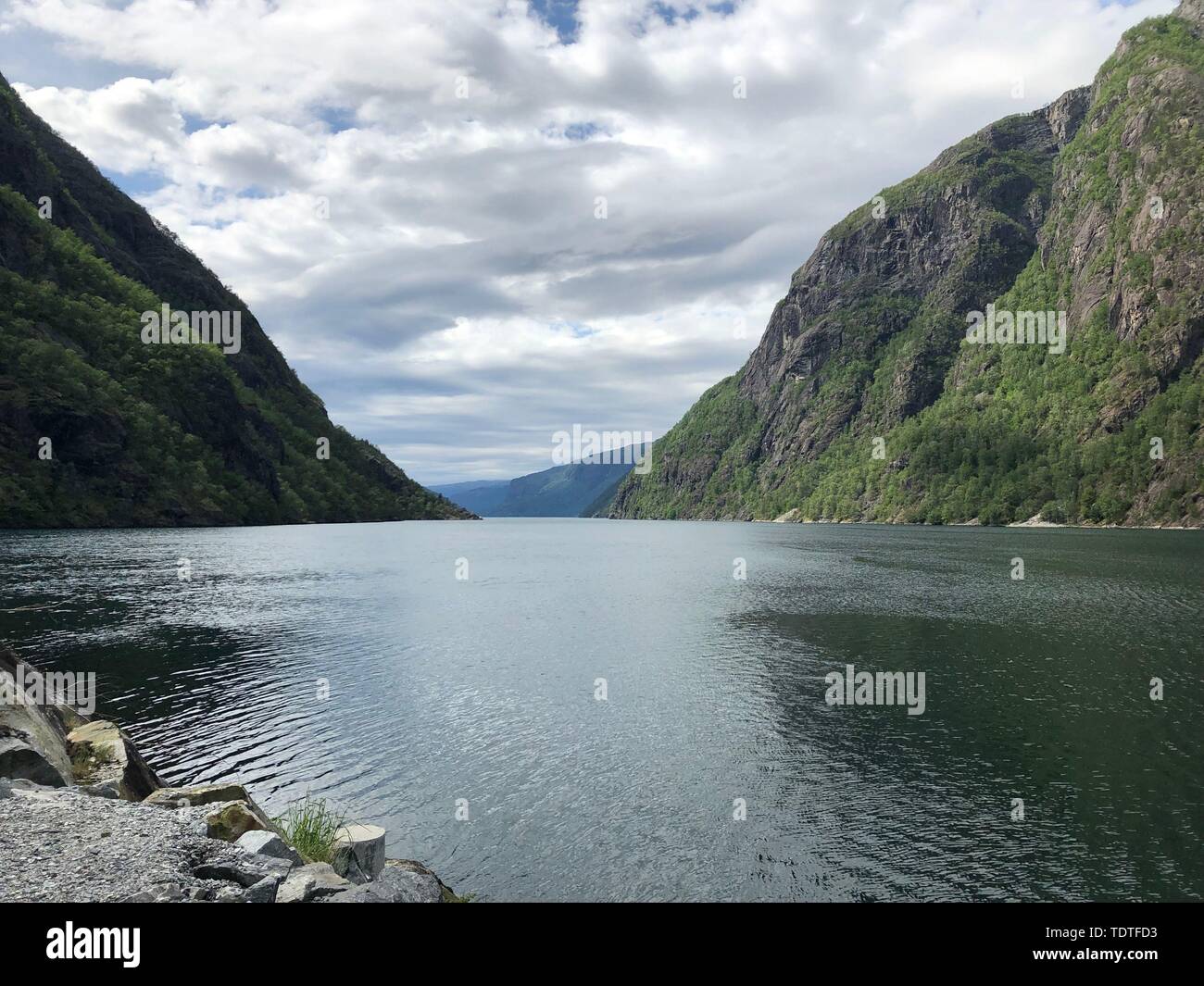 General view of a fjord in Norway, as water flowing from mountains to ...
