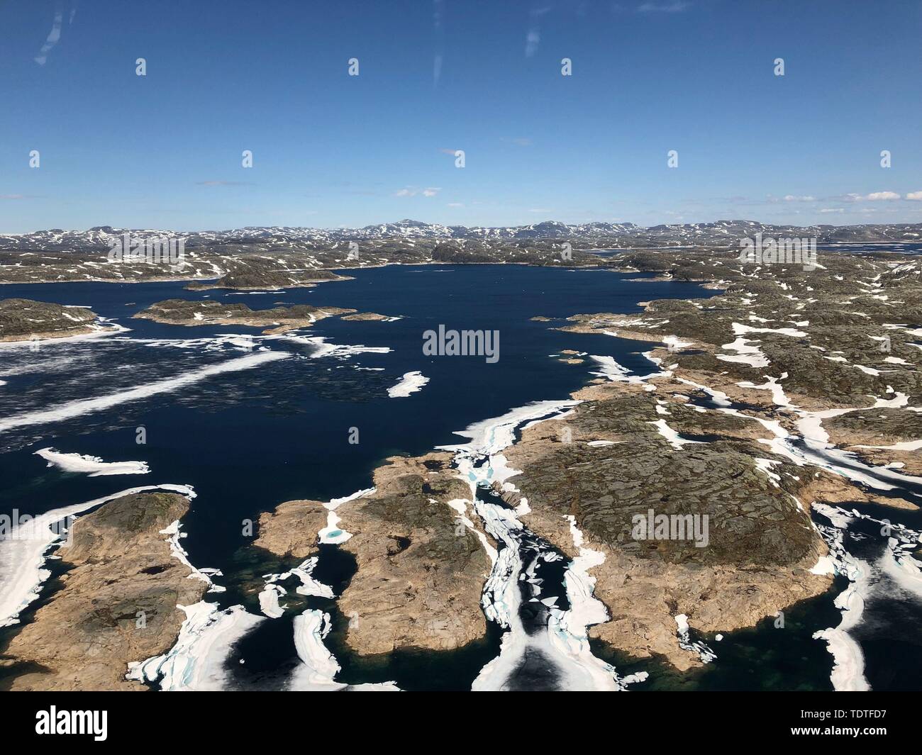 General view of a fjord in Norway, as water flowing from mountains to ...